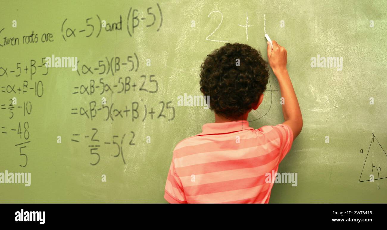 Image of math formulas over back view of biracial boy writing on black ...