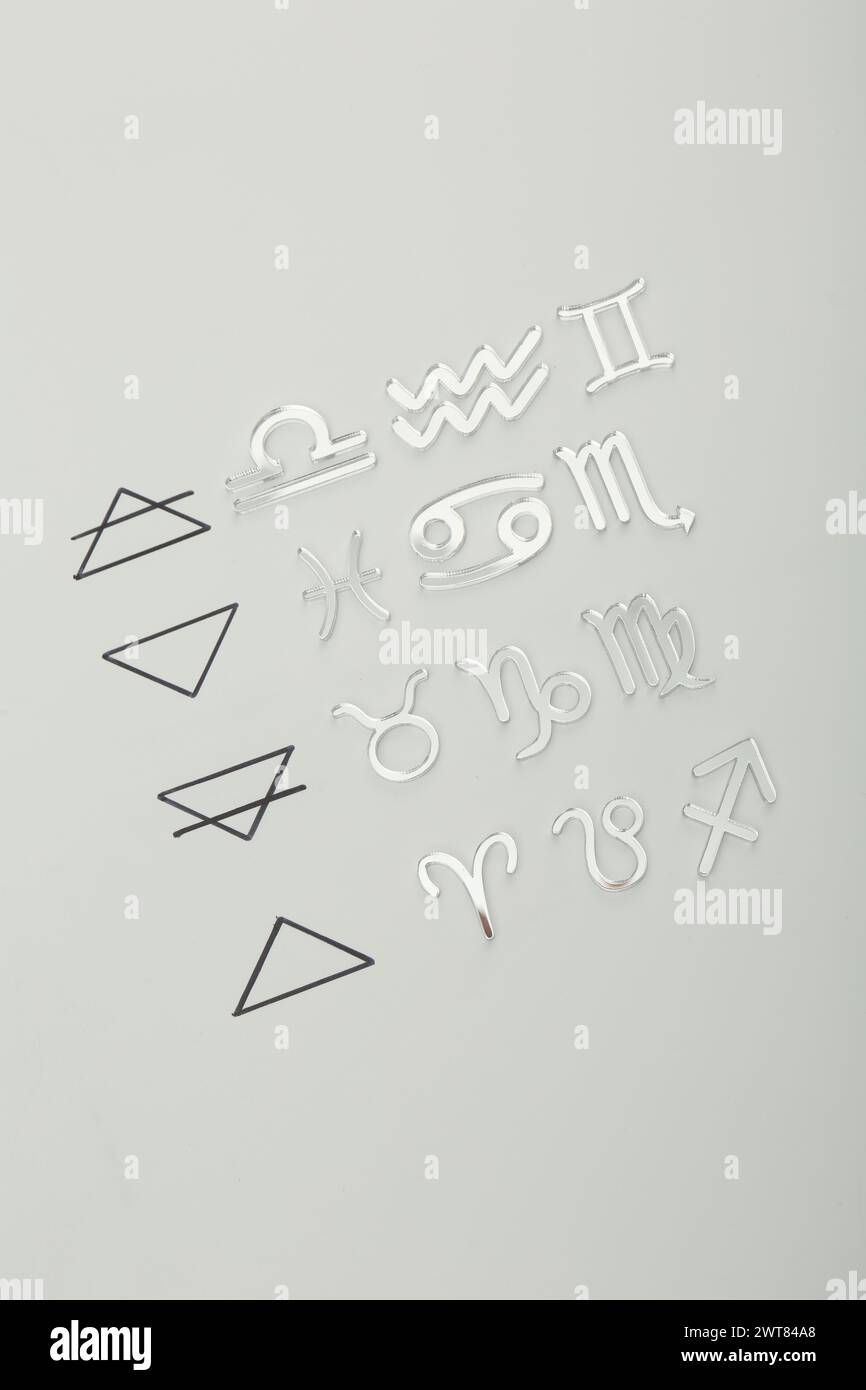 Zodiac triplicity. Four elements and corresponding signs on grey ...