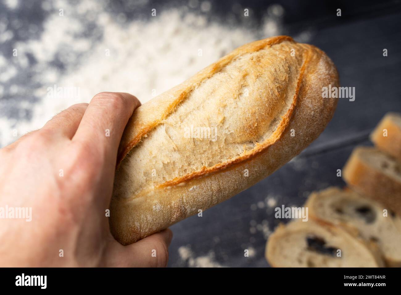 Augsburg, Bavaria, Germany - March 16, 2024: Man holding freshly baked ...