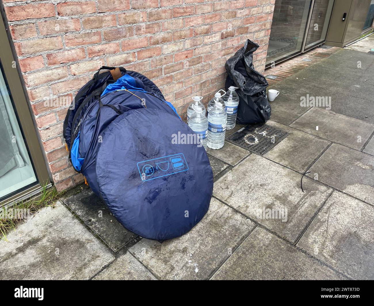 Tents are cleared after men who had been camping at the International ...