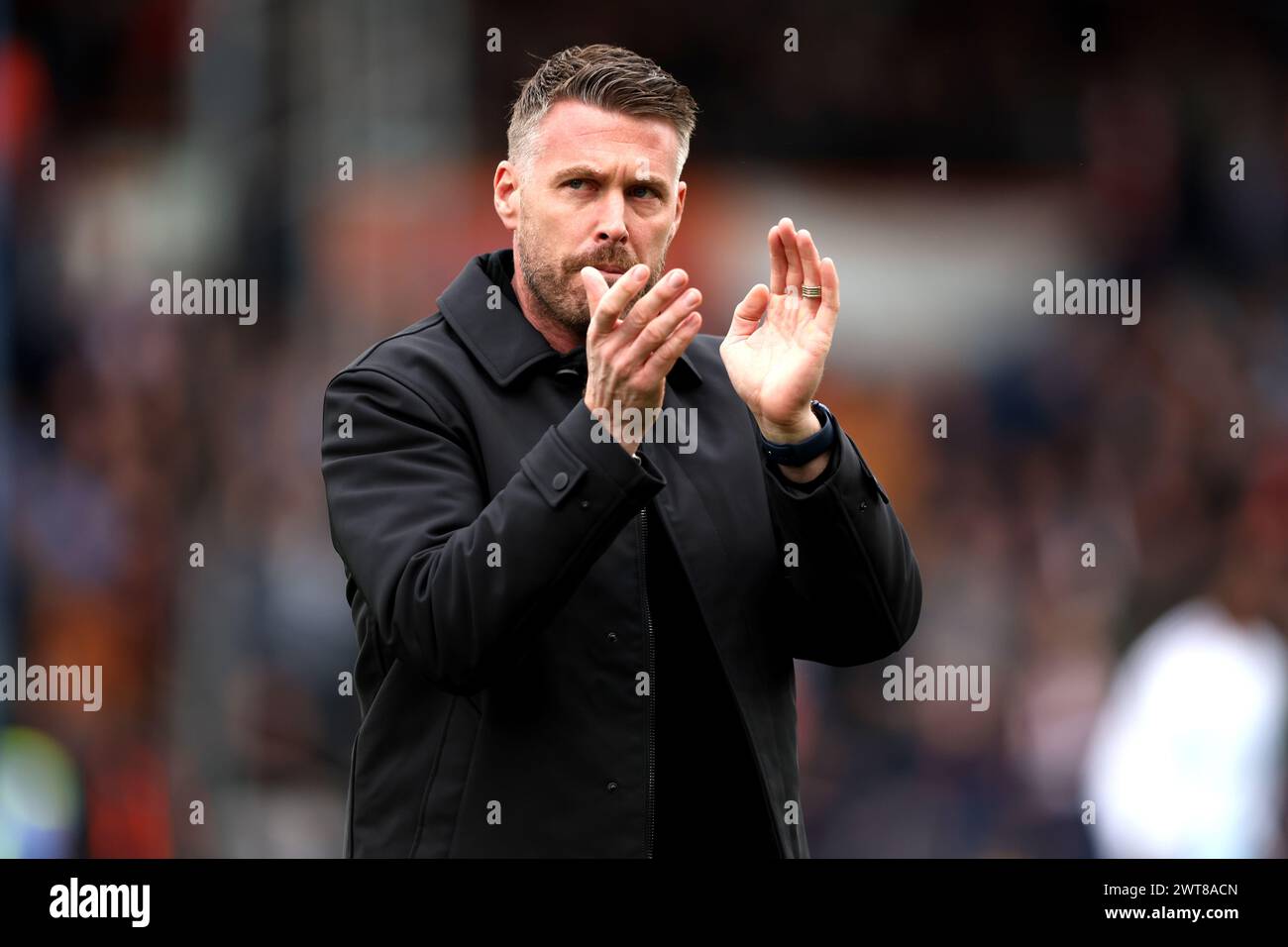 Luton Town manager Rob Edwards applauds the fans before the Premier ...