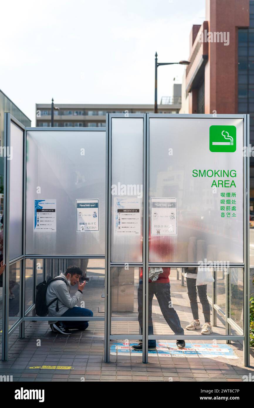 Designated smoking area on the street outside the station at Akashi ...