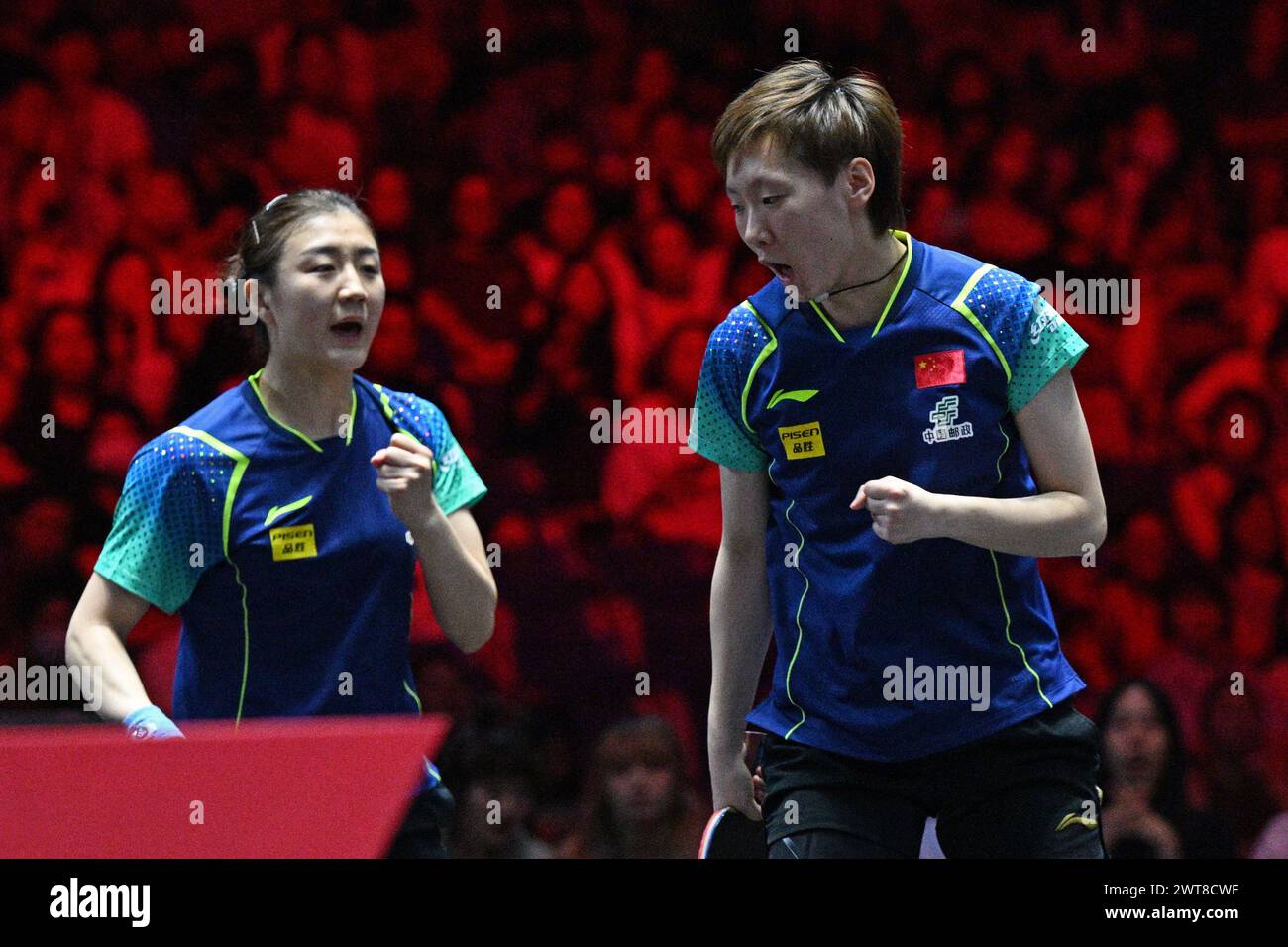 Singapore. 16th Mar, 2024. Chen Meng (L)/Wang Manyu of China celebrate during the women's ...