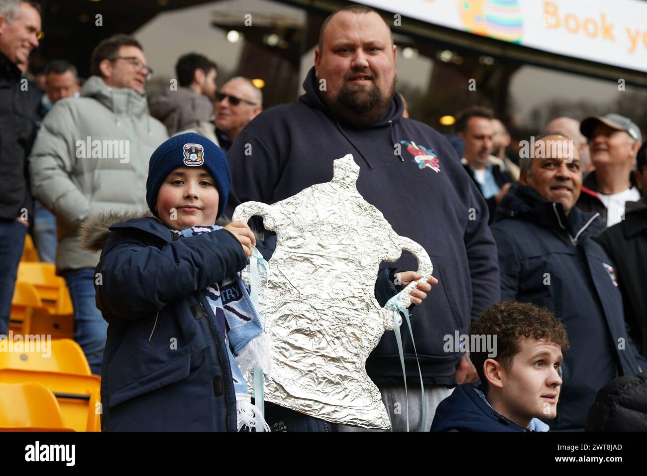 A Coventry City fan with a tin foil trophy in the stands before the ...
