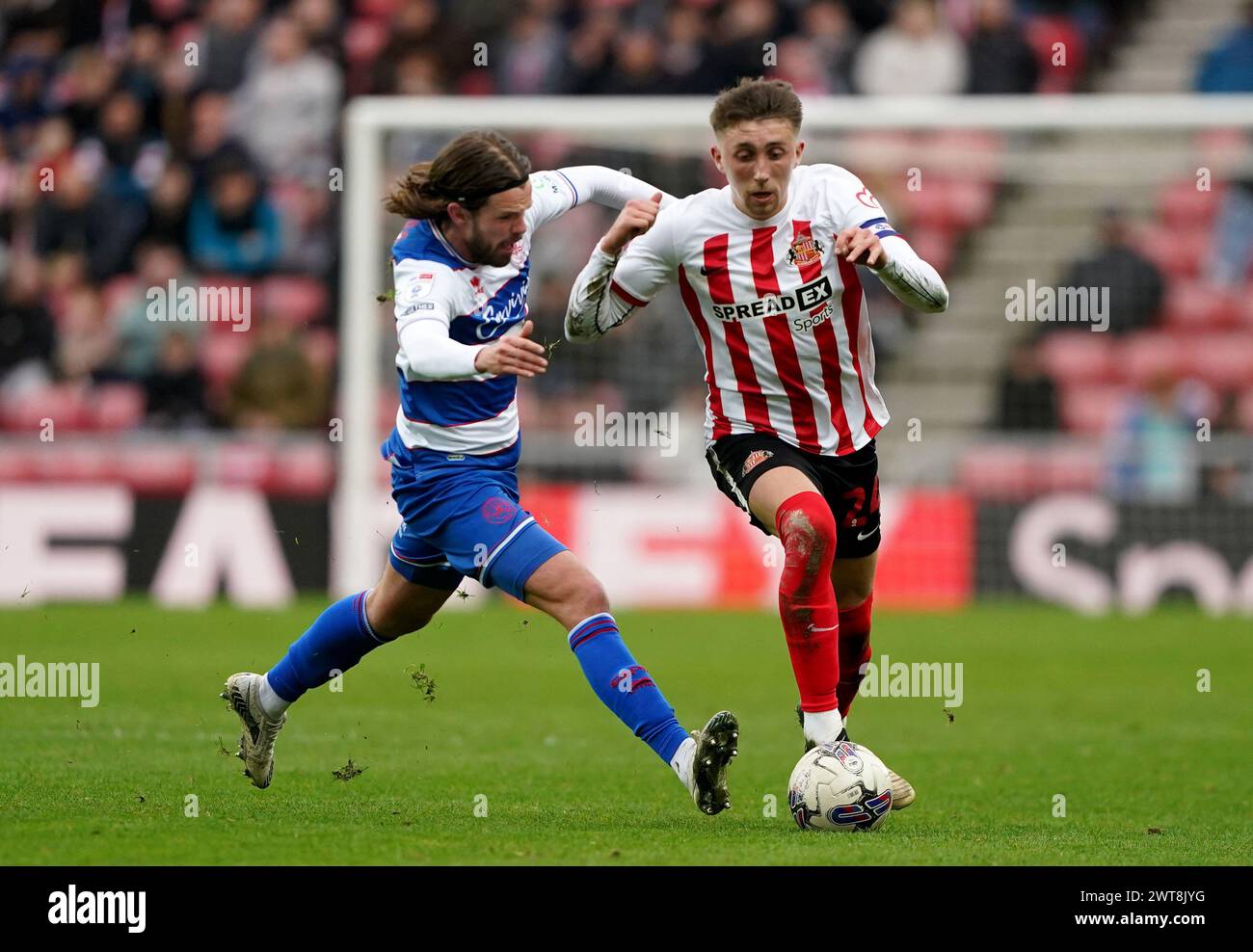 Sunderland's Dan Neil battles for the ball against Queens Park Rangers' Lucas Andersen during ...