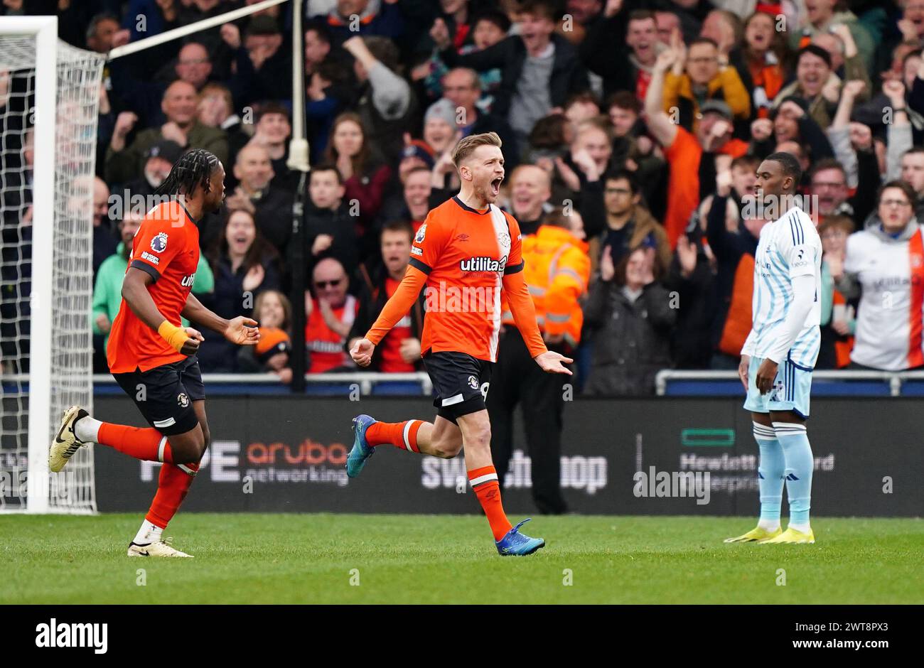 Luton Town's Luke Berry (centre) celebrates scoring their first goal of ...
