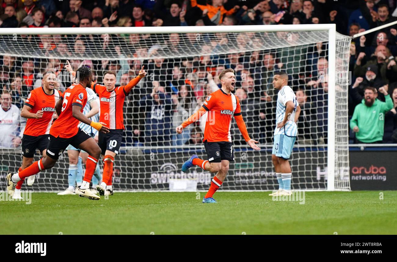 Luton Town's Luke Berry (centre) celebrates scoring their first goal of ...