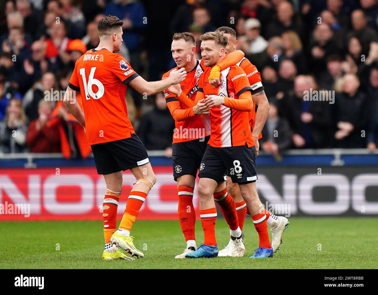 Luton Town's Luke Berry (second right) celebrates scoring their first ...