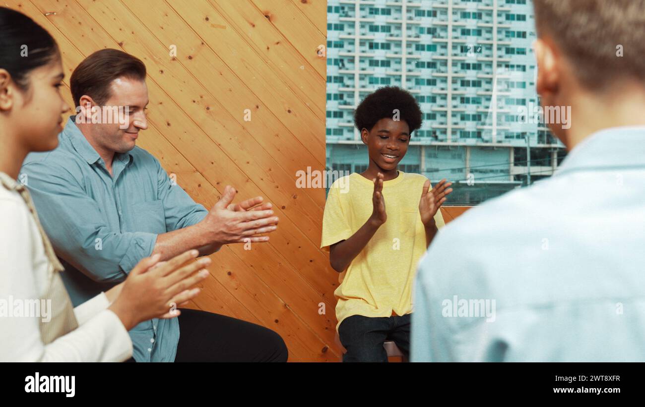 Multicultural people clapping hands to encourage in group therapy. Happy diverse student clap ...