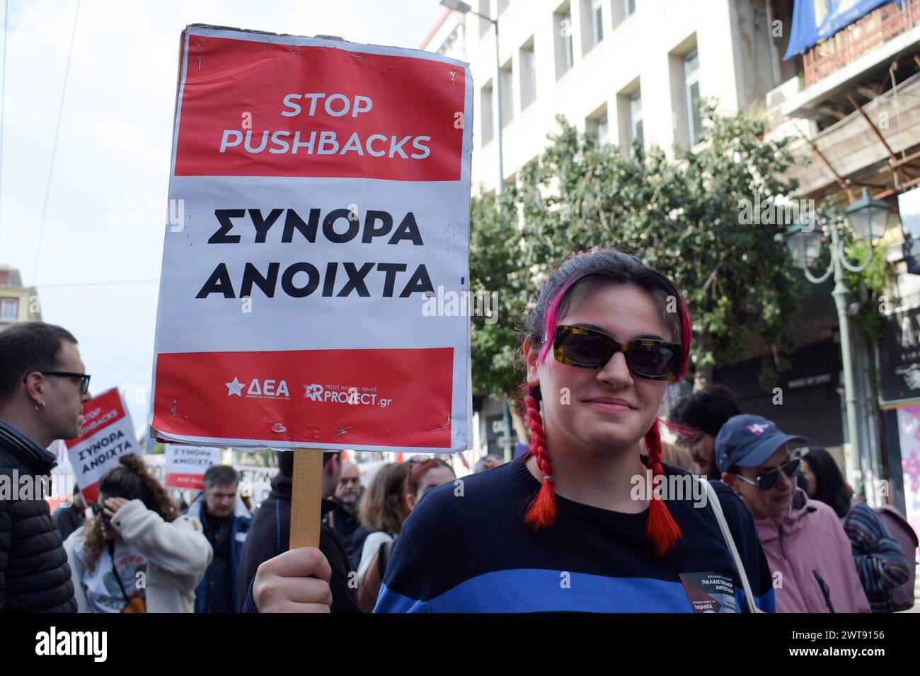 Athens, Greece. 16 March 2024. A woman holds a banner that reads “Stop Pushbacks” during the ...