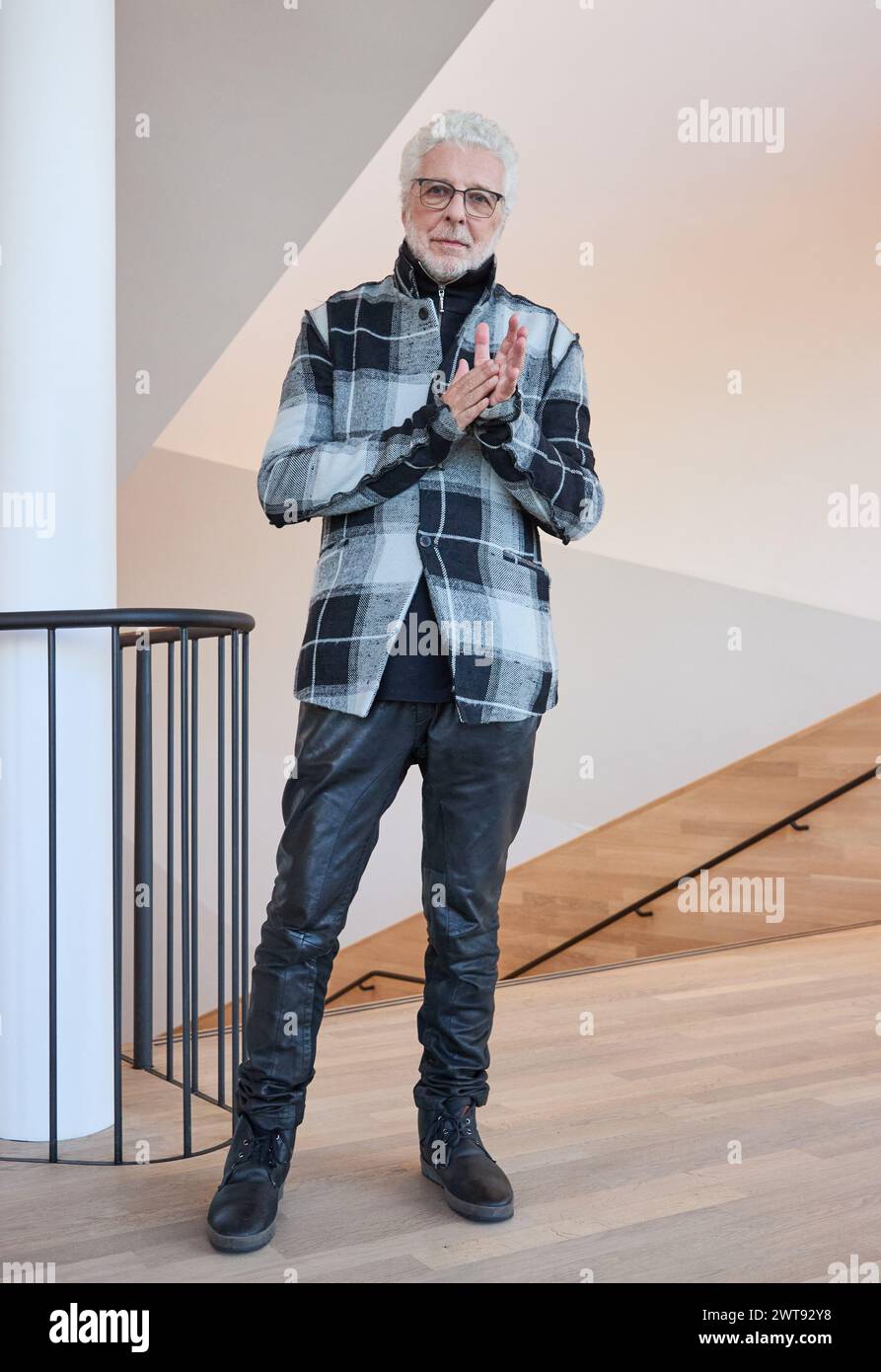 Hamburg, Germany. 16th Mar, 2024. André Heller, Austrian multimedia artist, stands in the foyer ...