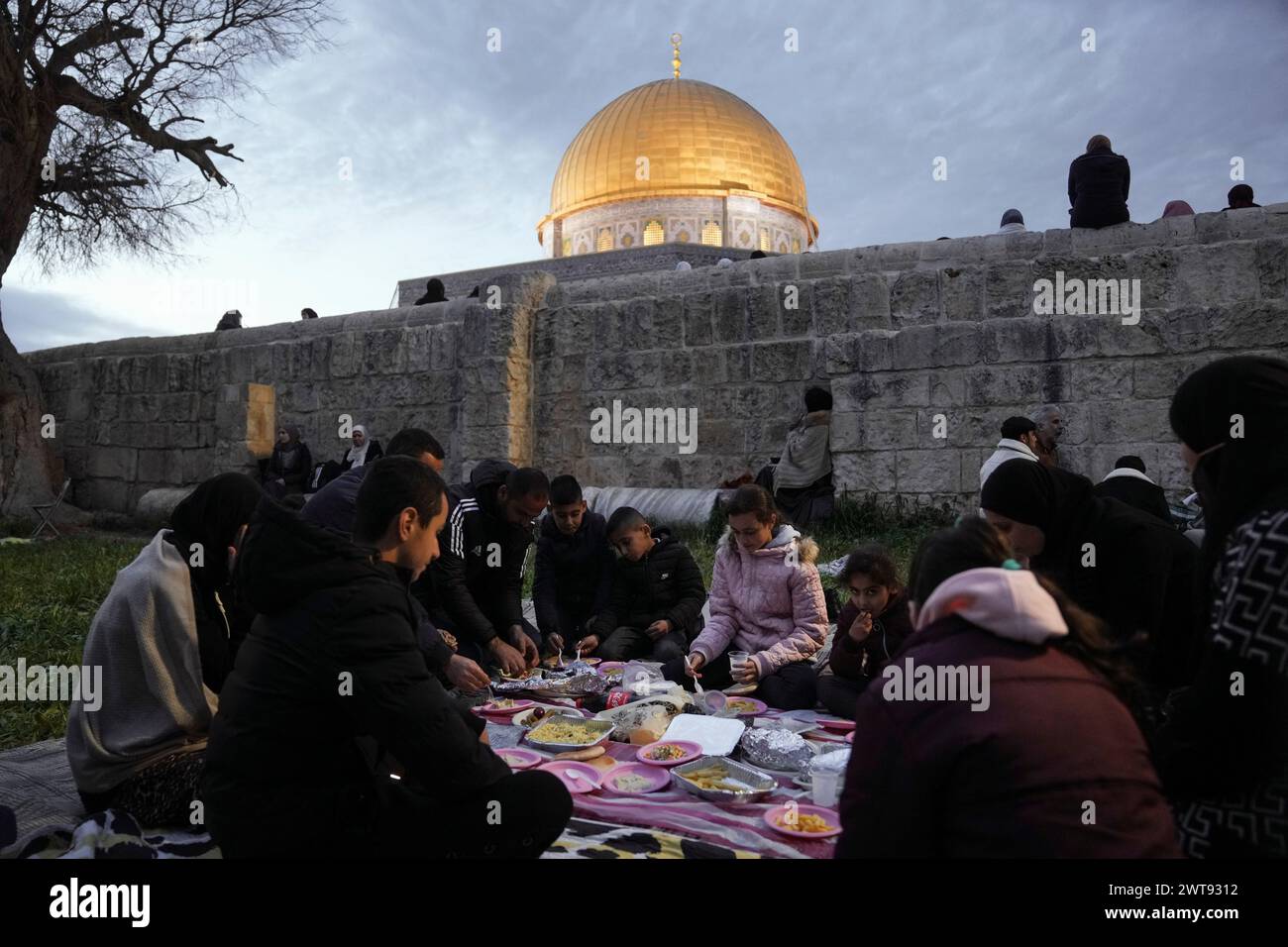 Palestinian Muslims break their fast during the Muslim holy month of ...