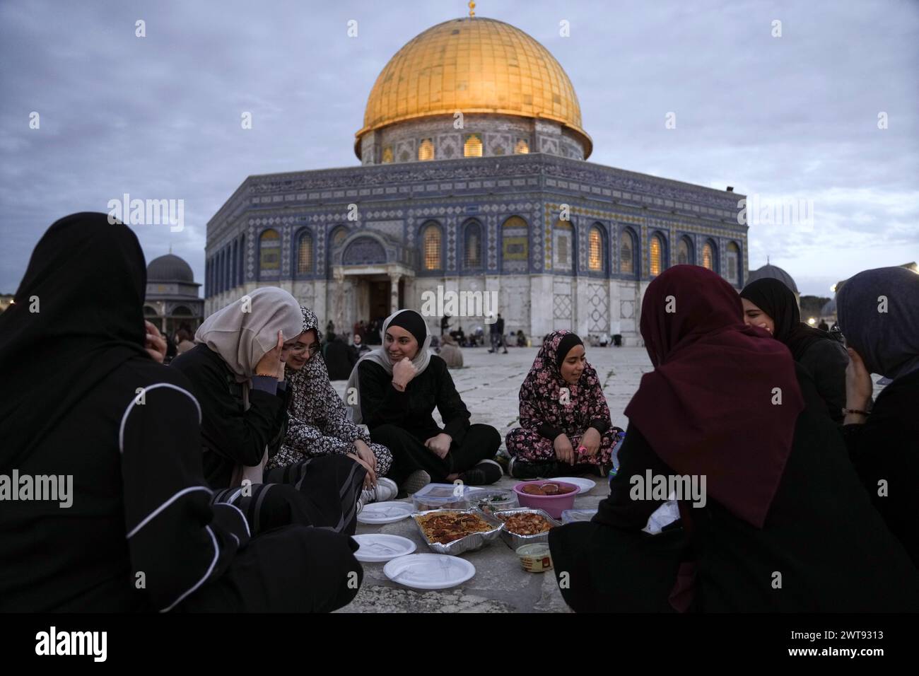 Palestinian Muslims break their fast during the Muslim holy month of ...