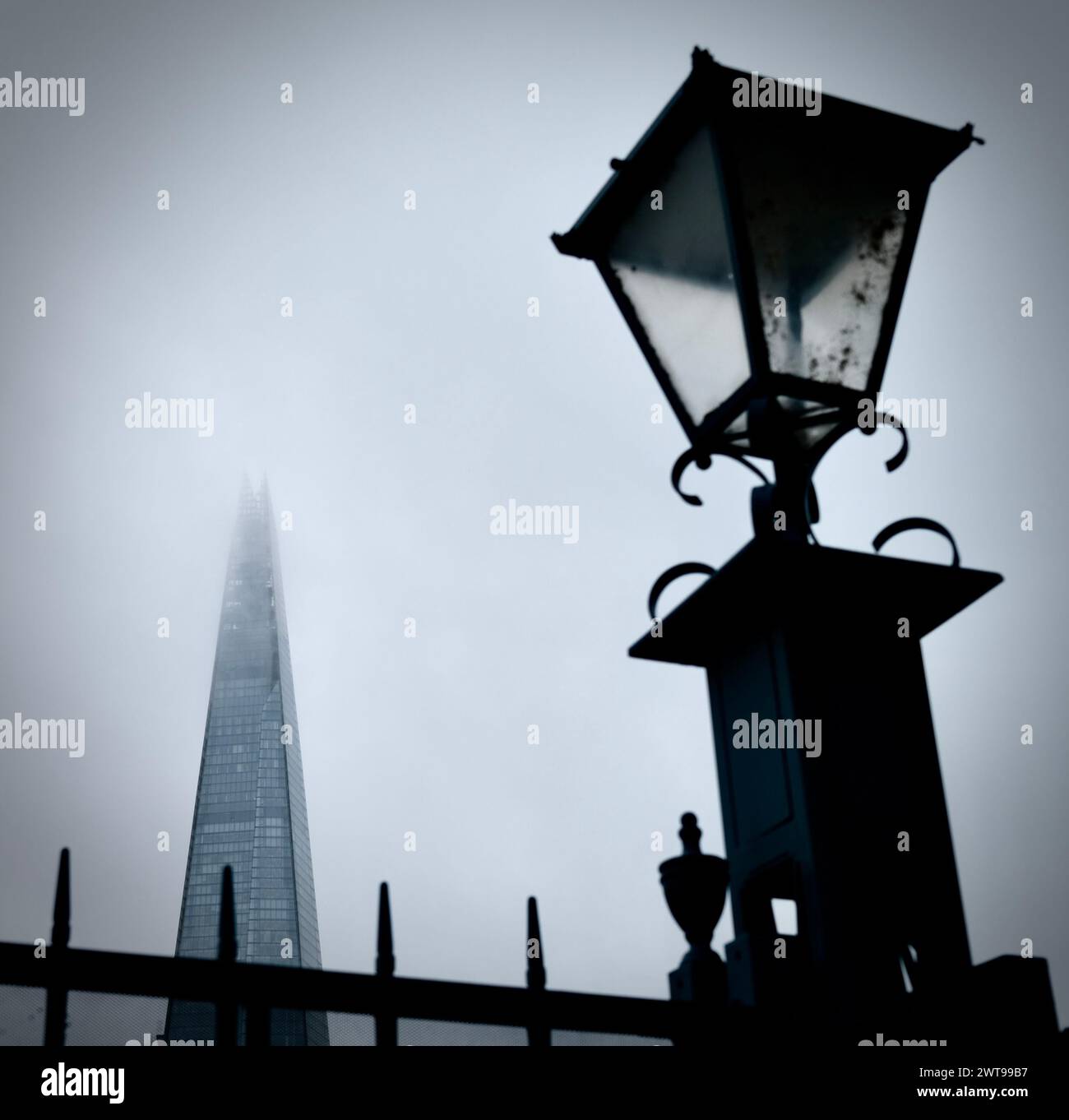 An English rain with the London Shard and Streetlamp Stock Photo - Alamy