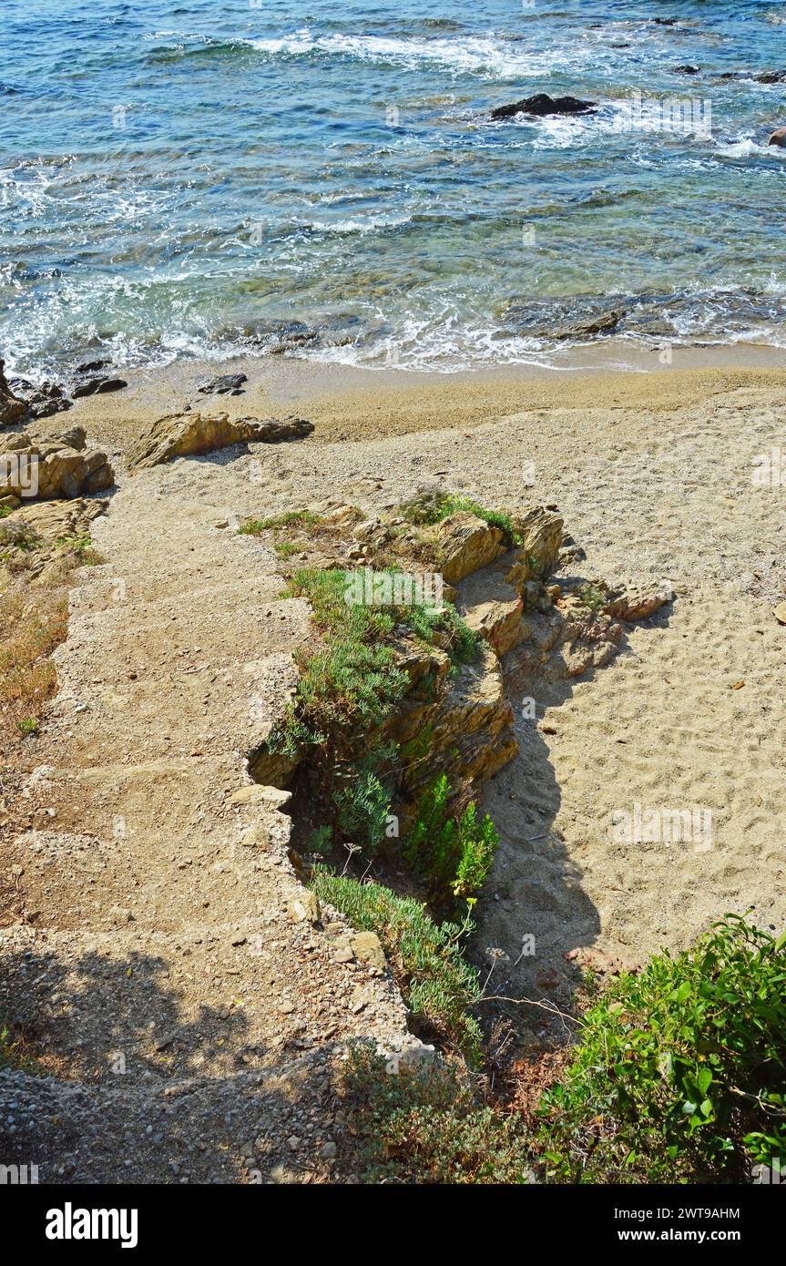 Old dilapidated concrete stairs on a sandy beach Stock Photo - Alamy
