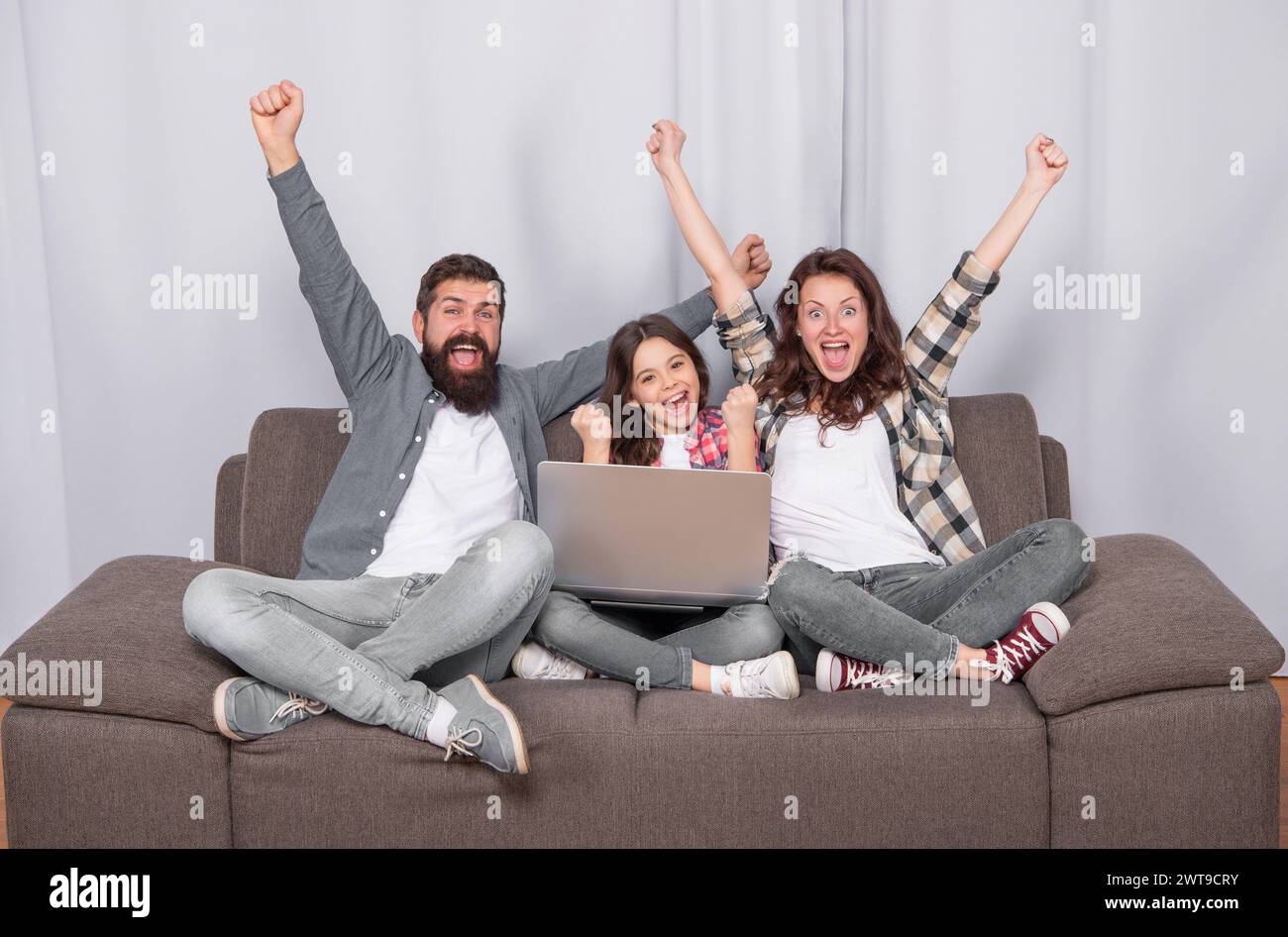 father mother and child use laptop. family blog. happy parents with kid ...