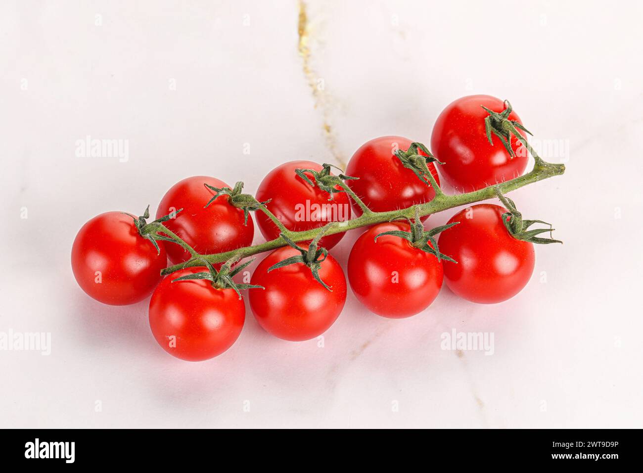 Ripe sweet cherry tomato branch isolated Stock Photo - Alamy