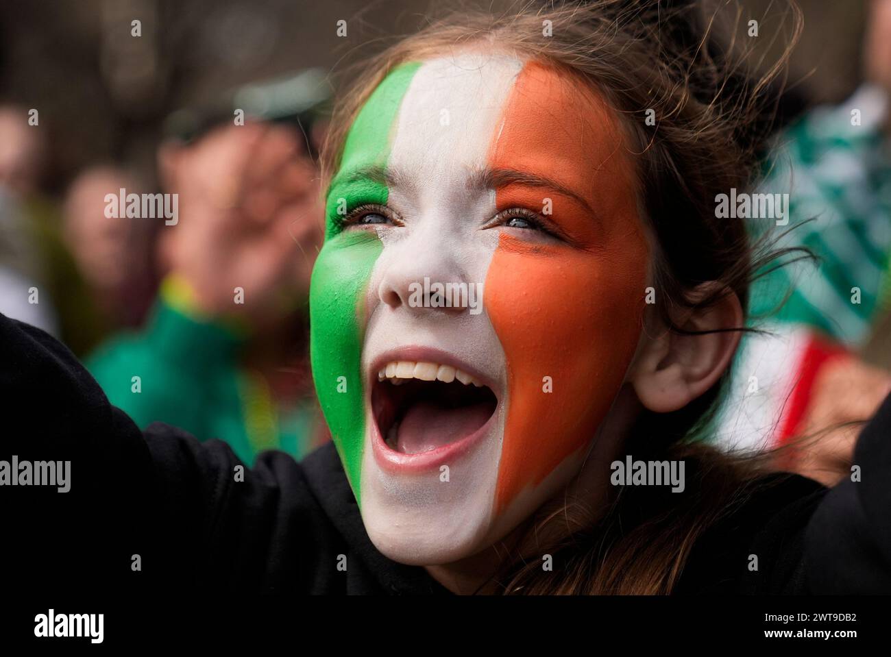 11-year-old Ava Impell of Pittsburgh watches the St. Patrick's Day ...