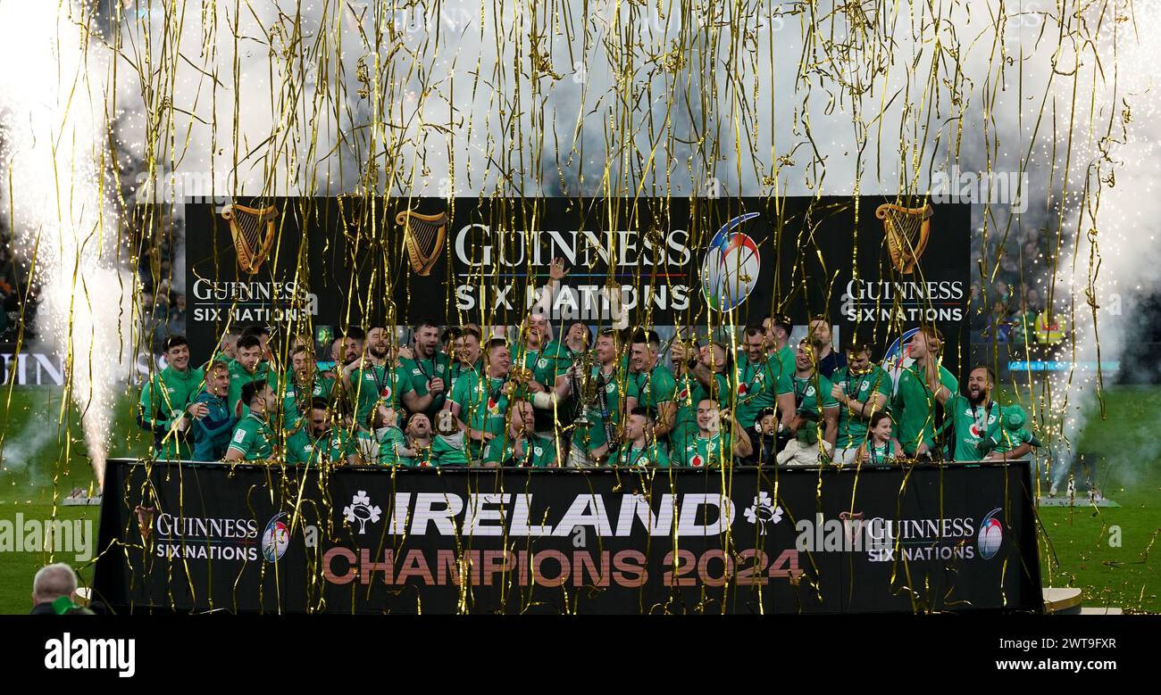 Ireland's players celebrate with the trophy after winning the Guinness ...