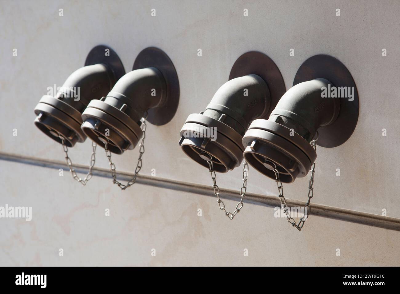 Fire hydrants on a white wall for connection to a fire engine Stock ...