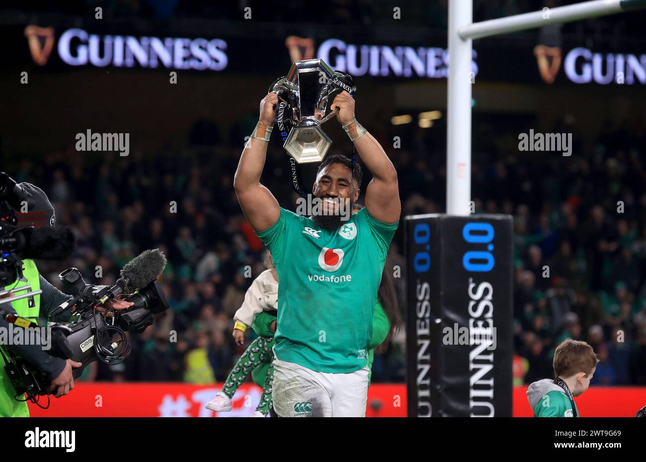 Ireland’s Bundee Aki celebrates with the Guinness Six Nations trophy ...