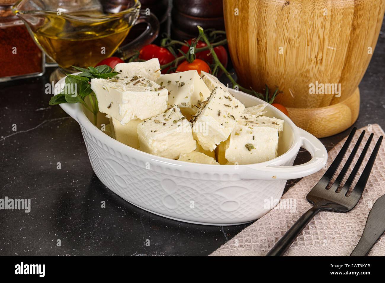 Greek traditional Feta cheese cubes with herbs and spices Stock Photo ...