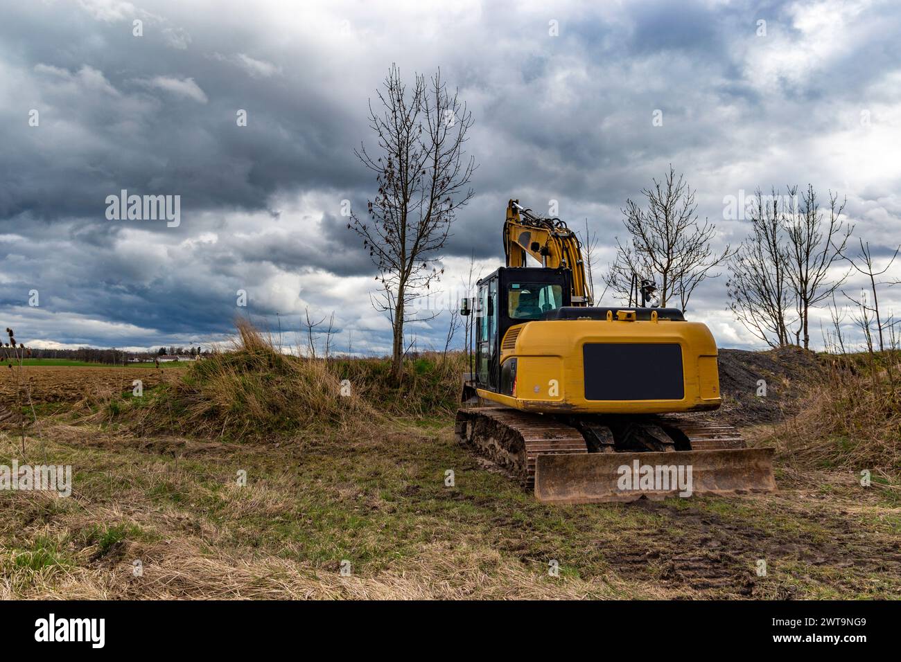 Industrial excavator in field Stock Photo - Alamy