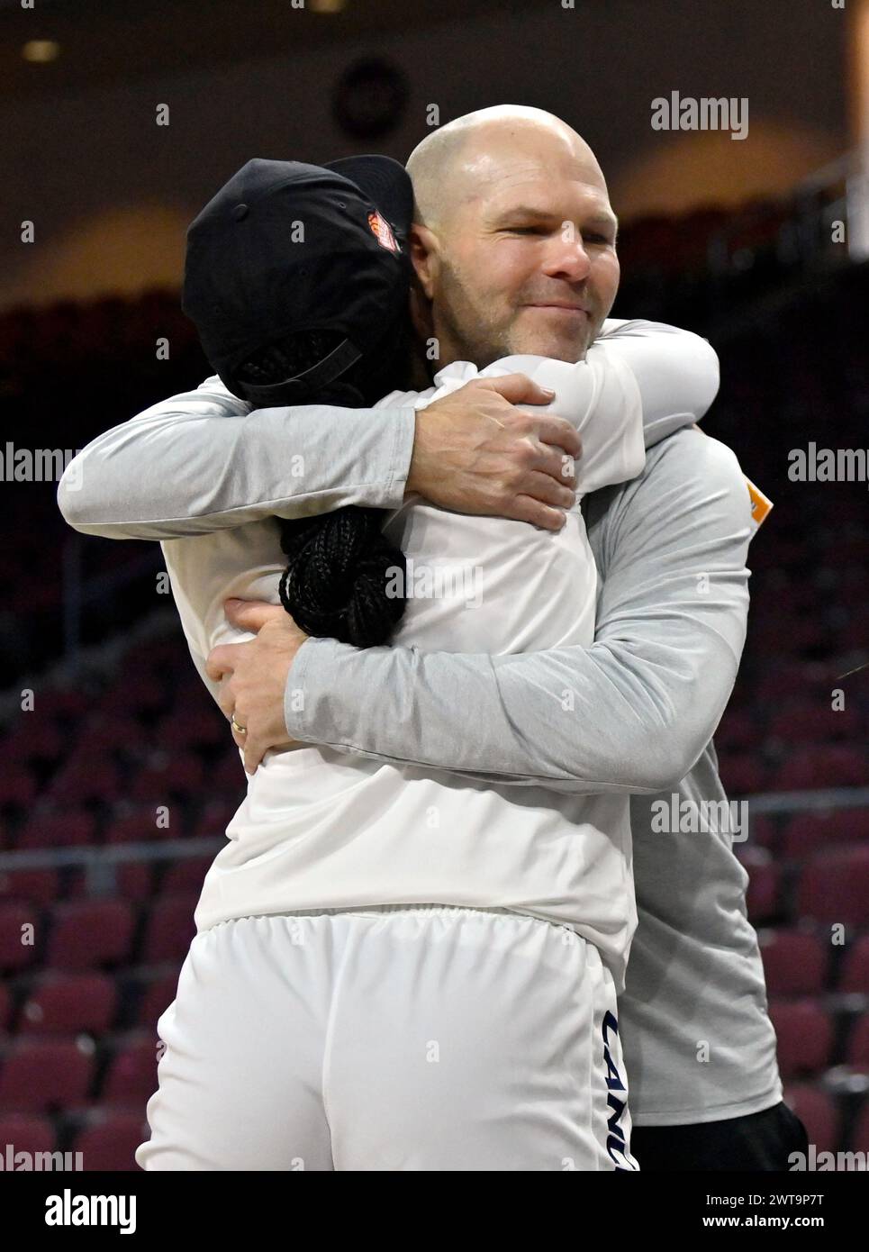California Baptist head coach Jarrod Olson hugs his player Nae Nae Calhoun after their team ...