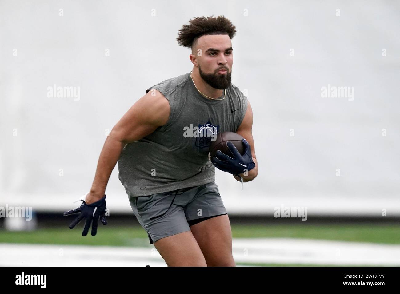 Penn State running back Trey Potts runs a drill during the NCAA college ...
