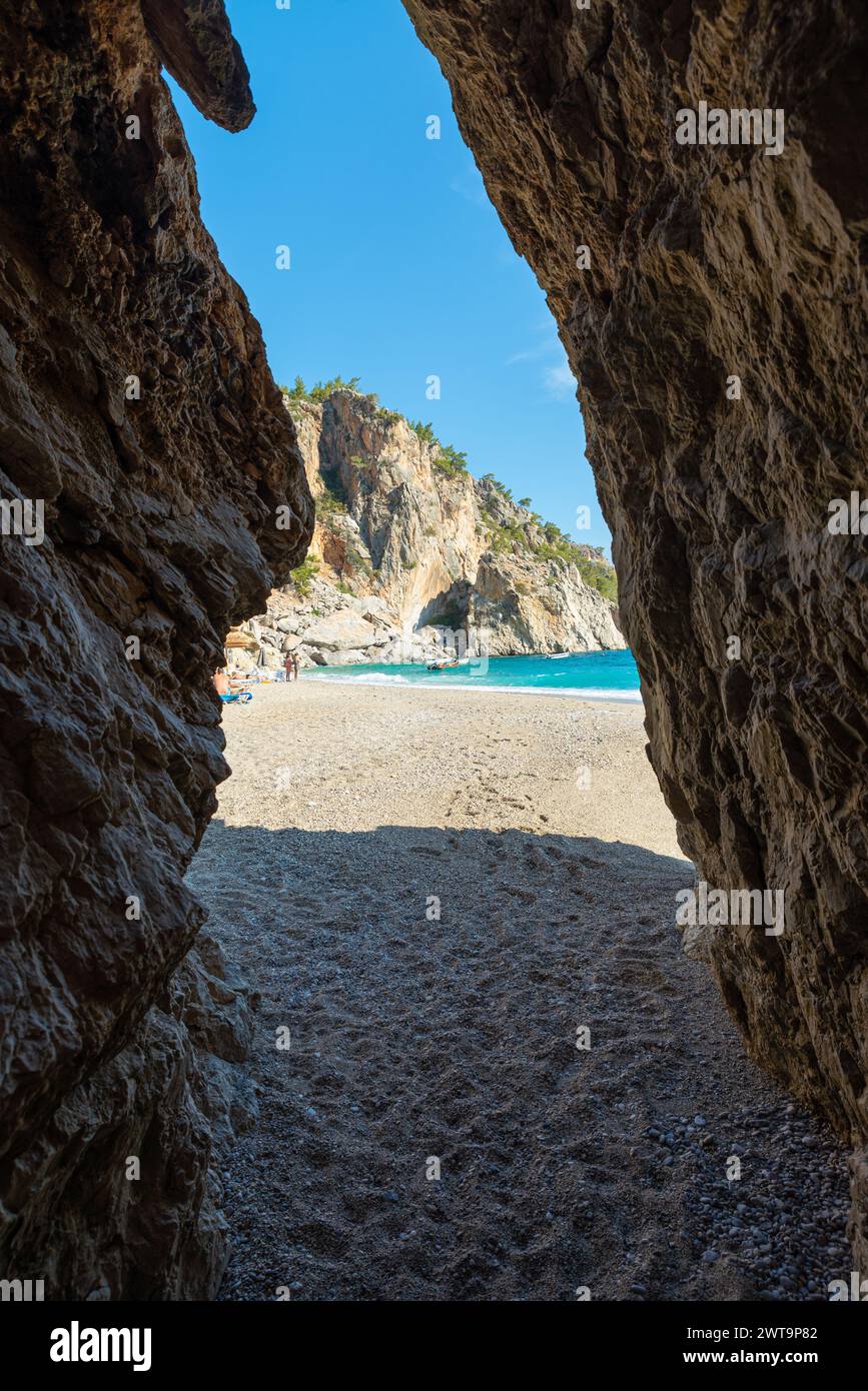 Cave on the beach. View from inside a cave into the beach in the Island ...