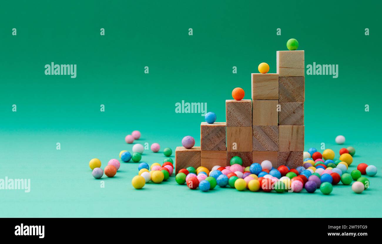 Wooden cubes forming a staircase with a sphere of a different color on ...