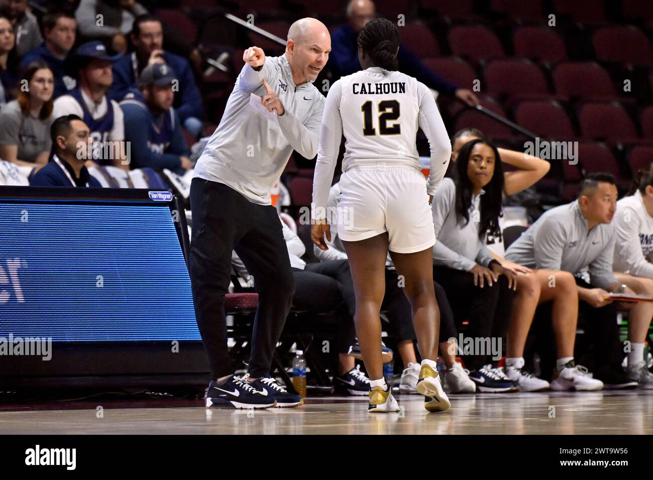 California Baptist head coach Jarrod Olson talks with guard Nae Nae Calhoun (12) during the ...