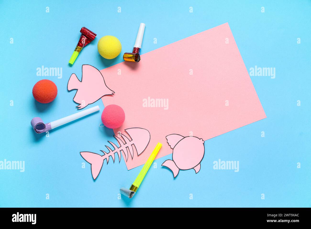 Blank card with paper fishes and party decor on blue background. April ...