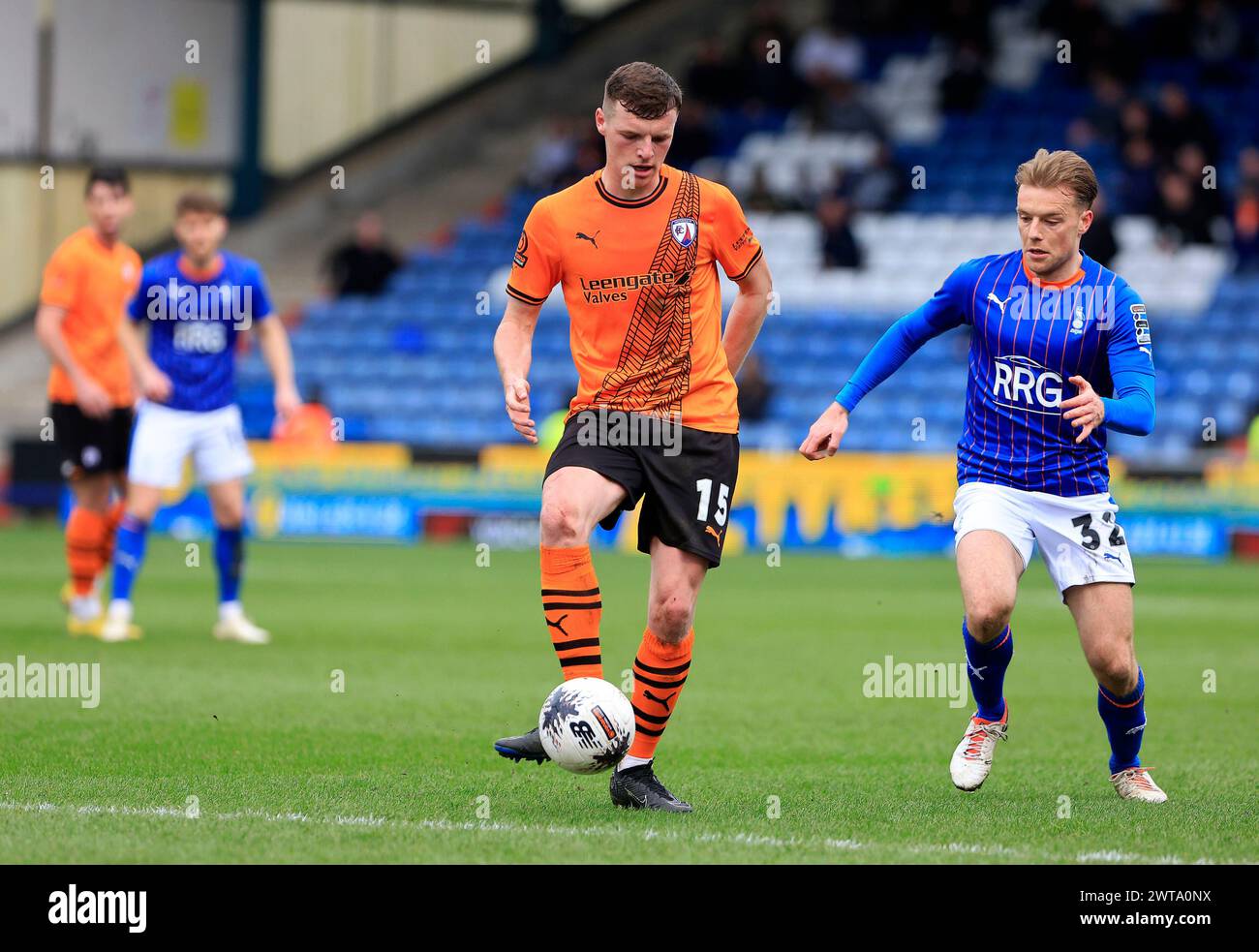 Bailey Hobson of Chesterfield Football Club is tussling with Tom Conlon ...