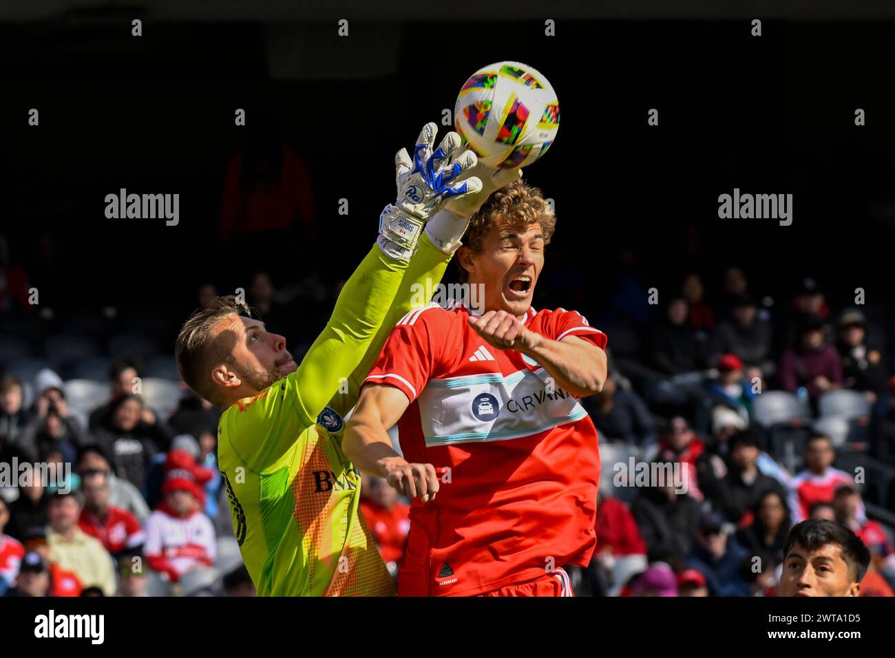 CF Montréal goalkeeper Jonathan Sirois, left, reaches for a high ball ...