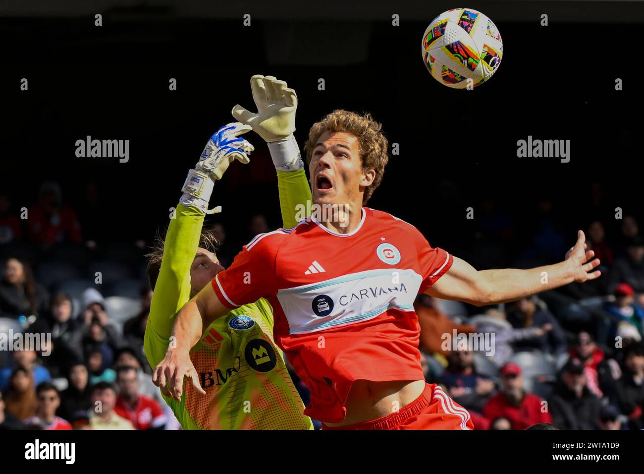 CF Montréal goalkeeper Jonathan Sirois, left, reaches for a high ball ...
