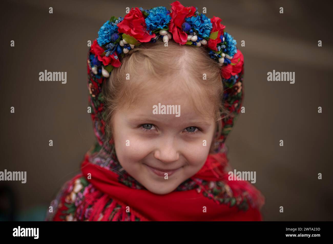 A child poses for a portrait during a show of traditions for Masnytsia ...