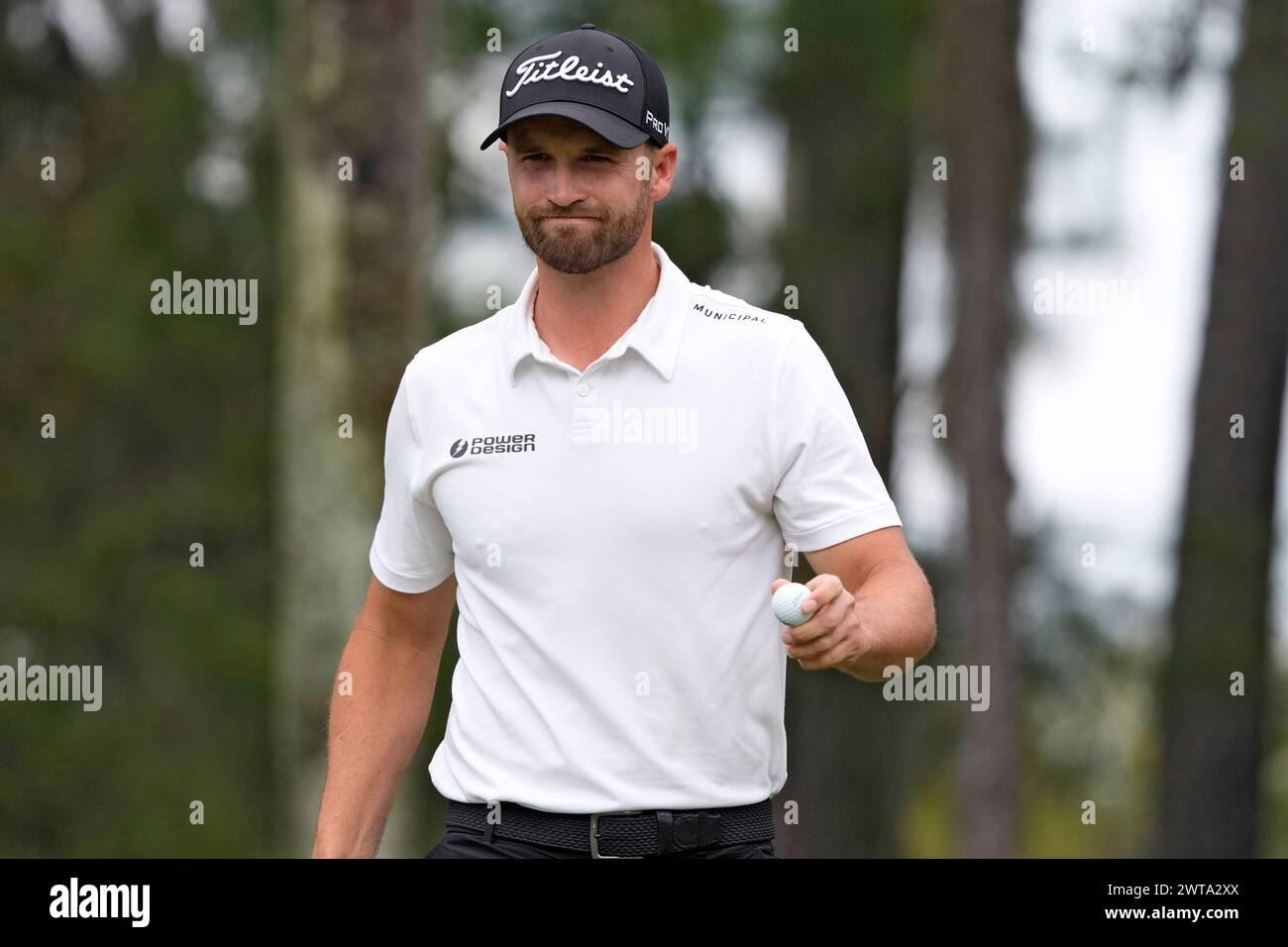 Wyndham Clark reacts after his putt on the fifth hole during the third ...