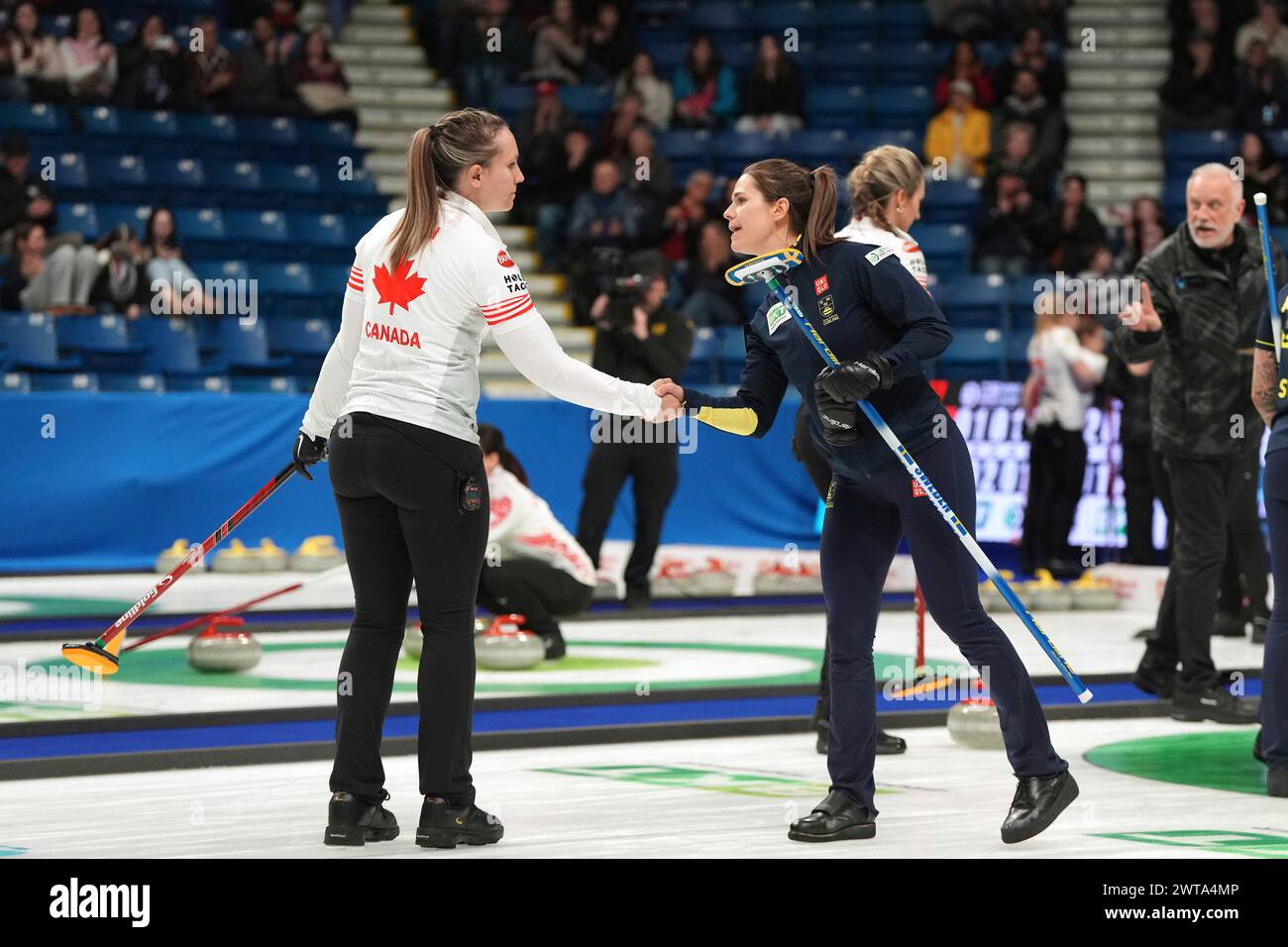 Canada kip Rachel Homan, left, shakes hands with Sweden skip Anna ...