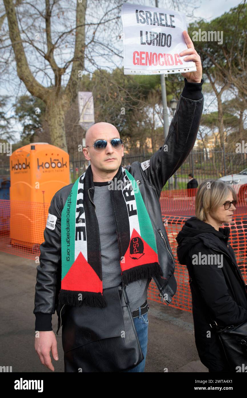Rome, Italy. 16th Mar, 2024. A man with a shaved head shows the sign ...