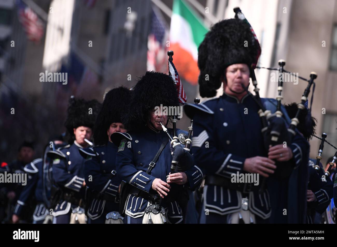 New York, USA. 16th Mar, 2024. Members of a bagpipe band march in the ...