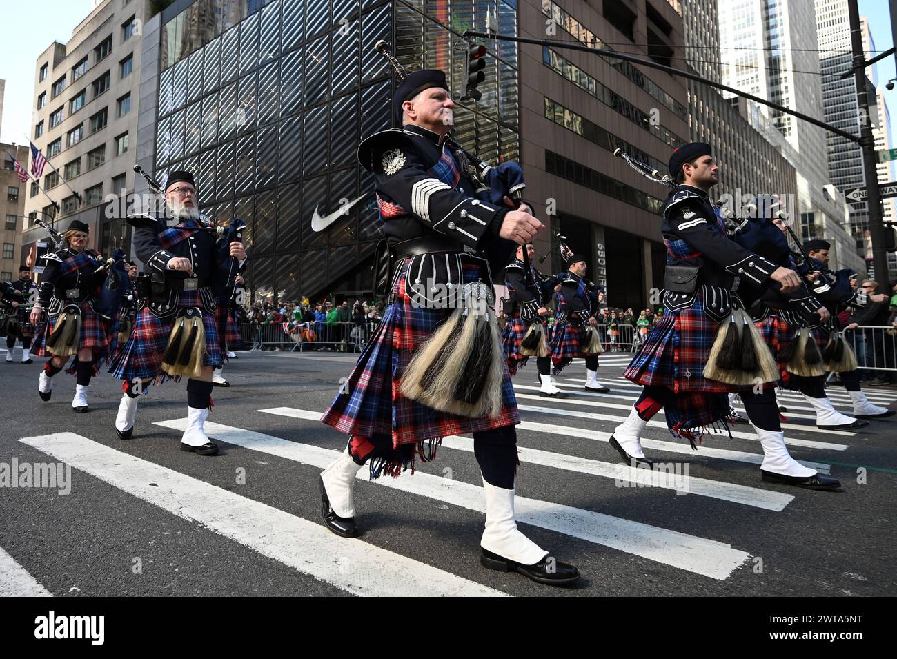 New York, USA. 16th Mar, 2024. Members of a bagpipe band march in the ...