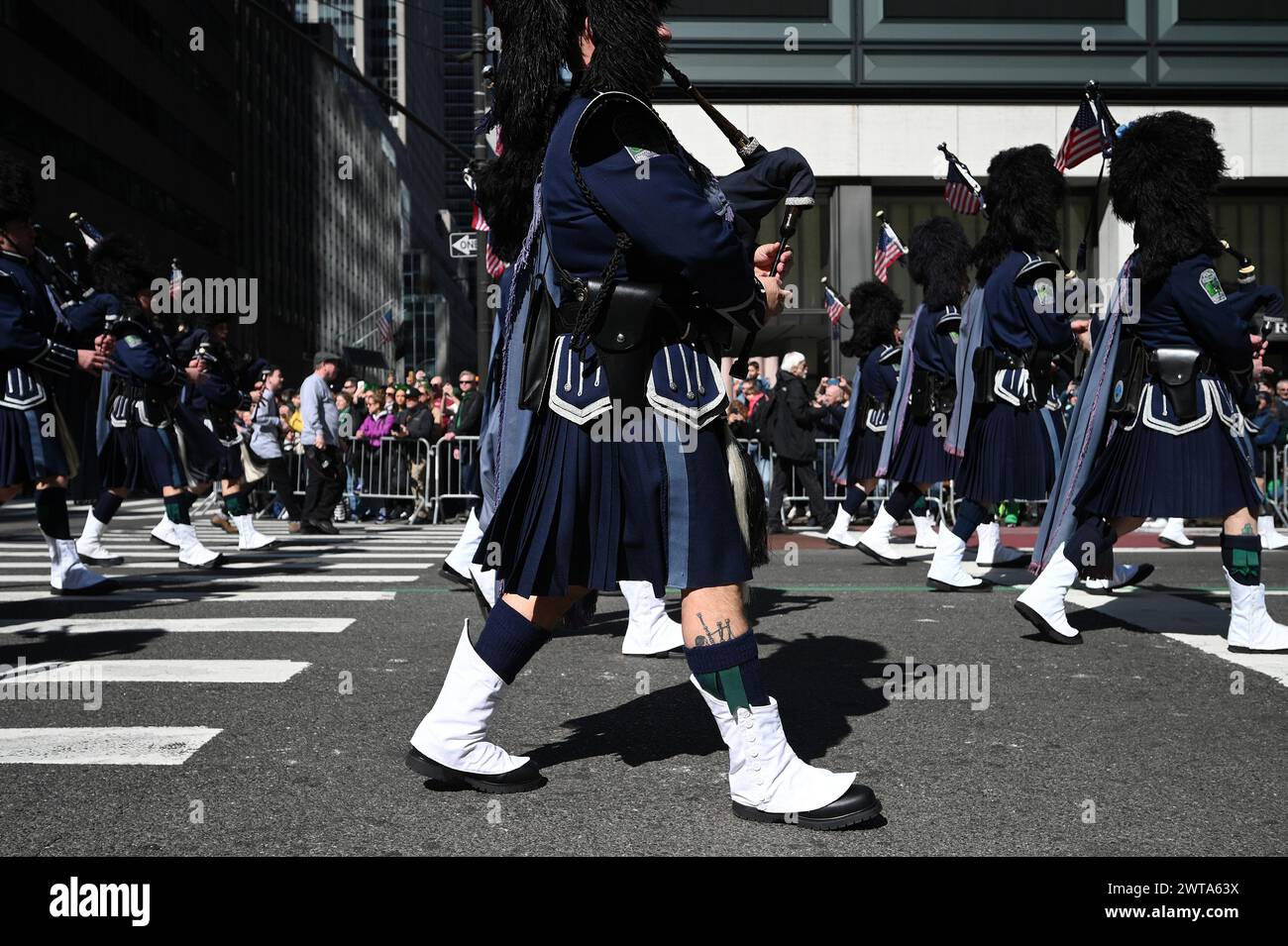 New York, USA. 16th Mar, 2024. Members of a bagpipe band march in the ...