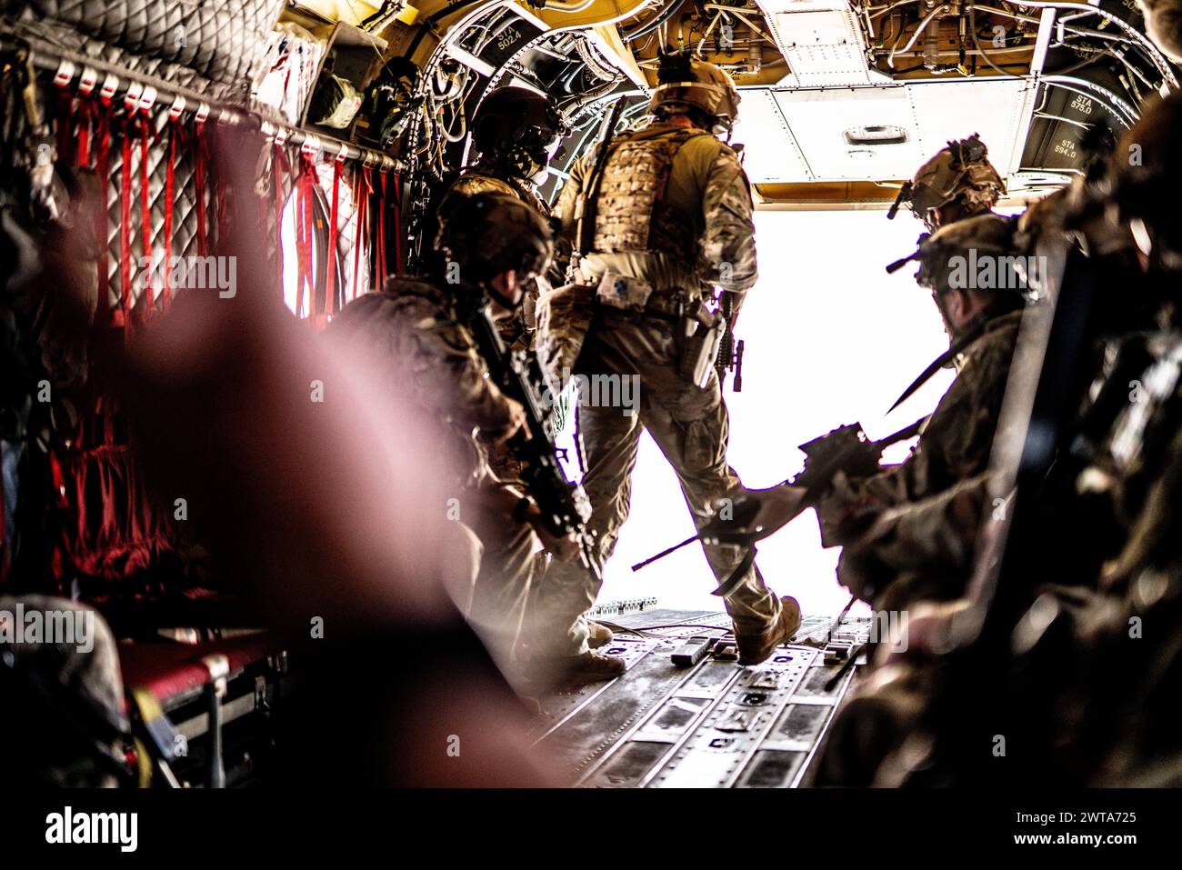 U.S. Army Soldiers assigned to the 10th Mountain Division board a CH-47 ...