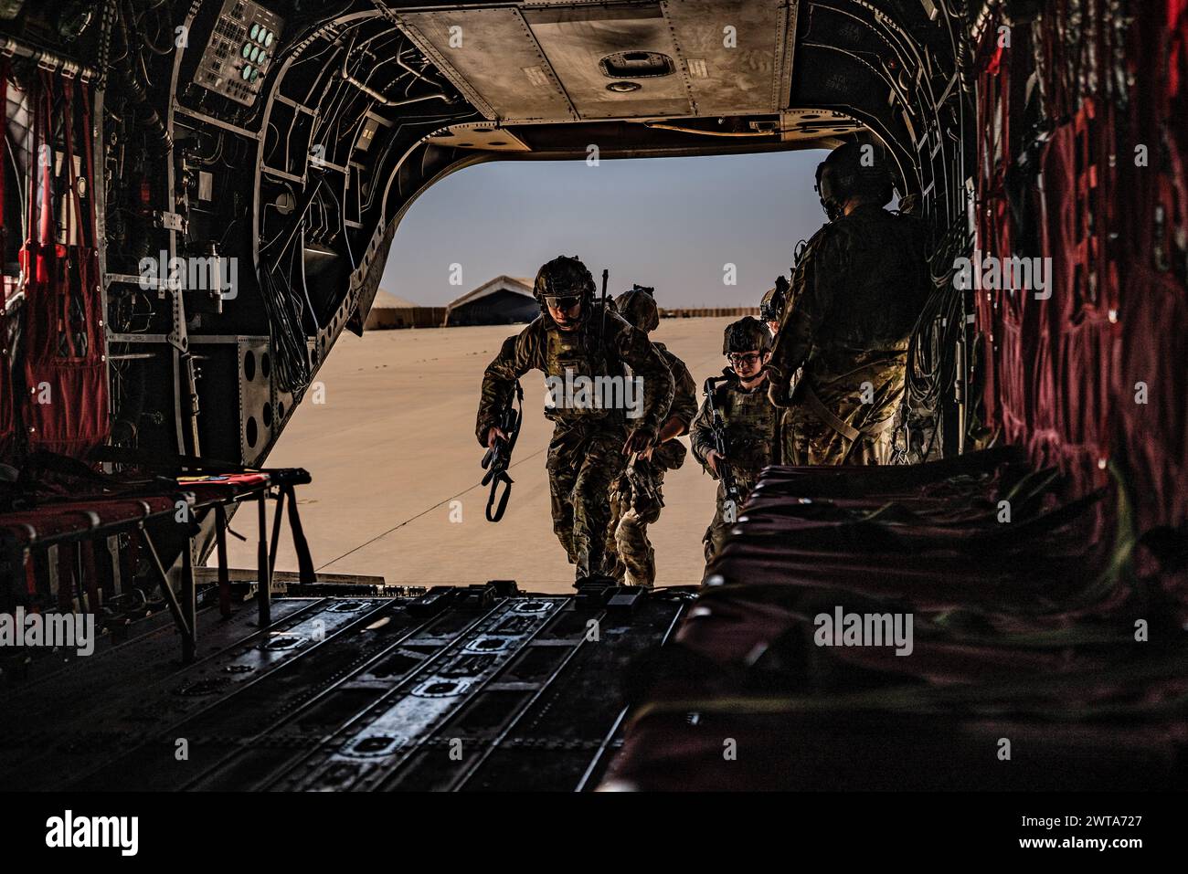 U.S. Army Soldiers assigned to the 10th Mountain Division board a CH-47 ...