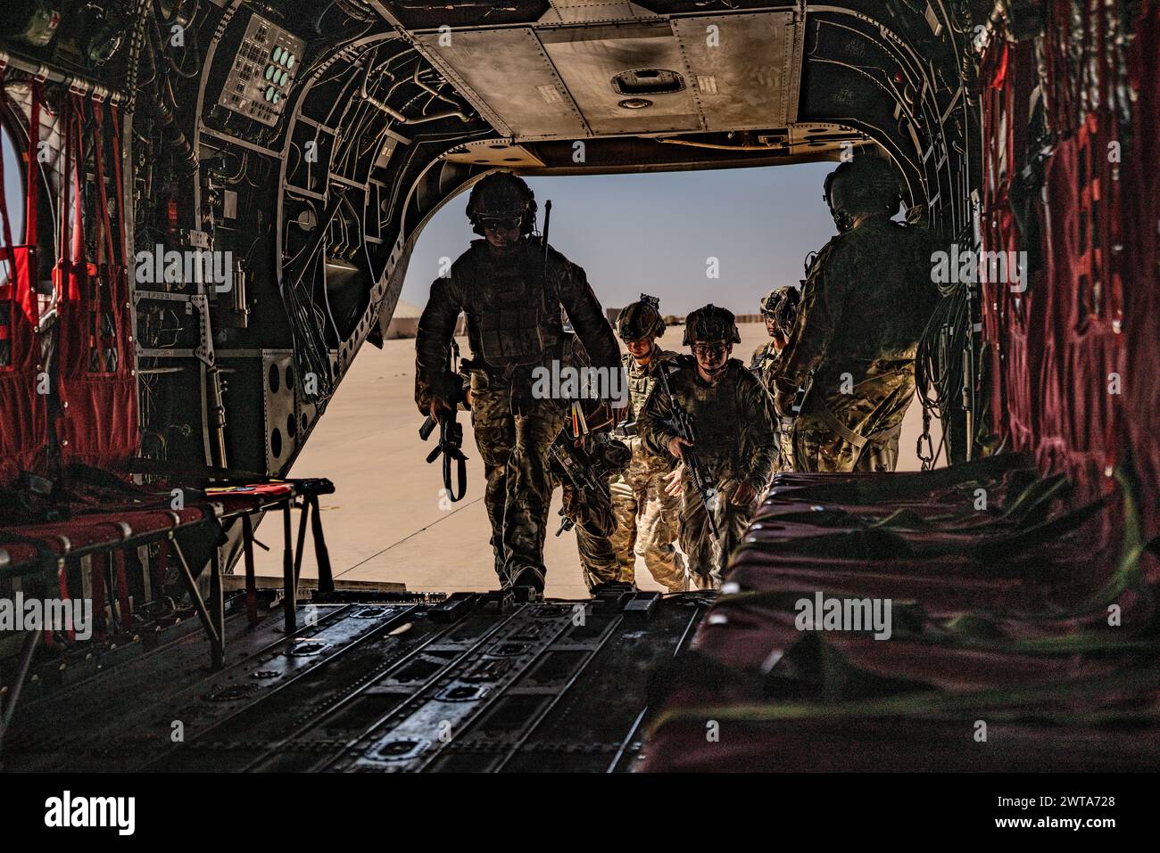 U.S. Army Soldiers assigned to the 10th Mountain Division board a CH-47 ...