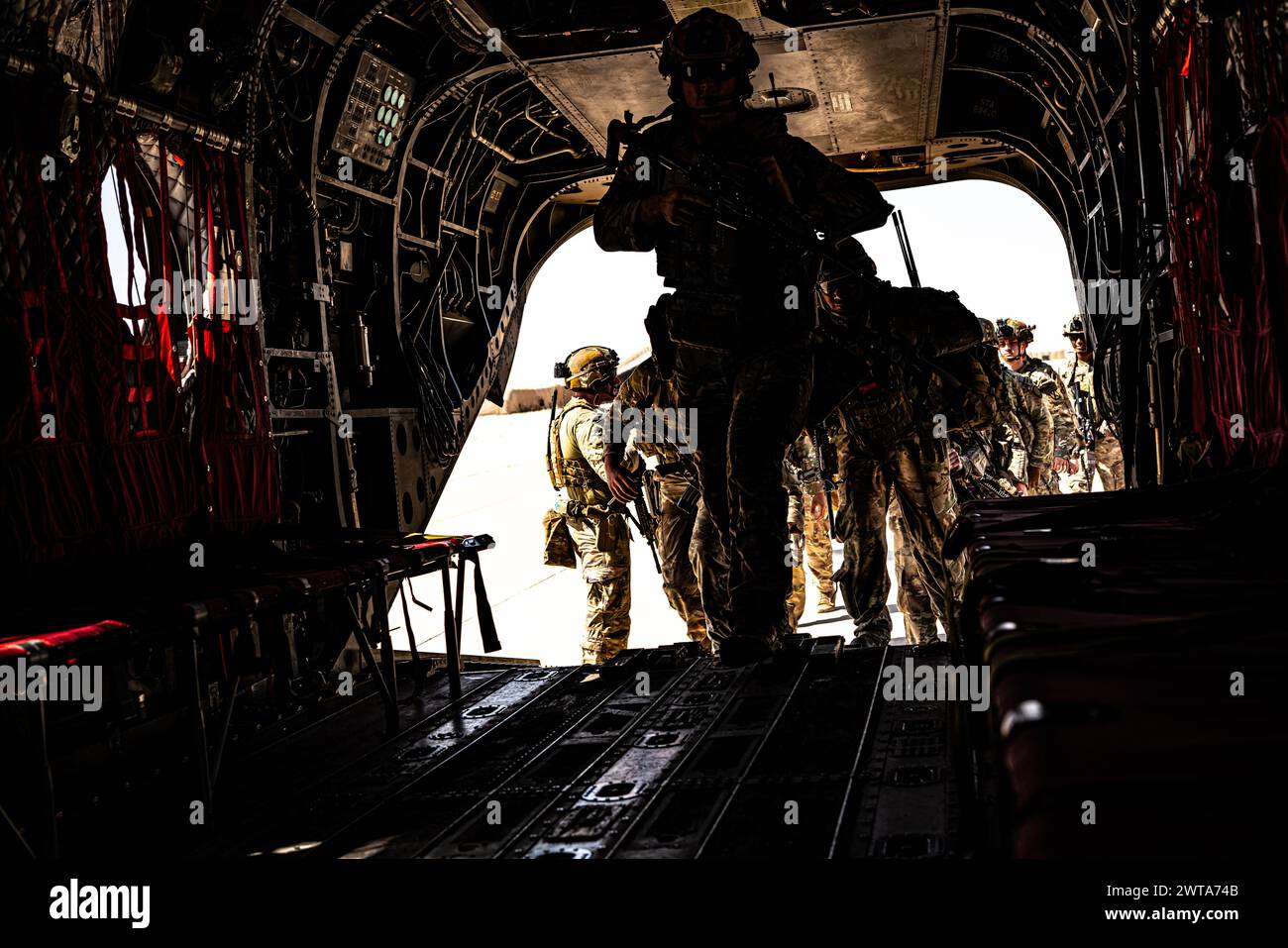 U.S. Army Soldiers assigned to the 10th Mountain Division board a CH-47 ...