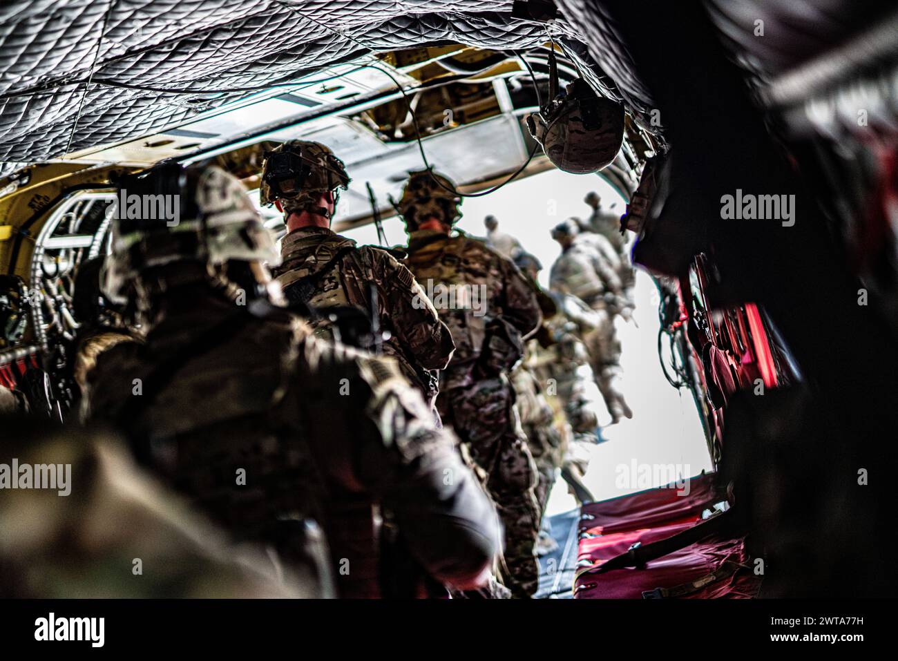 U.S. Army Soldiers assigned to the 10th Mountain Division board a CH-47 ...