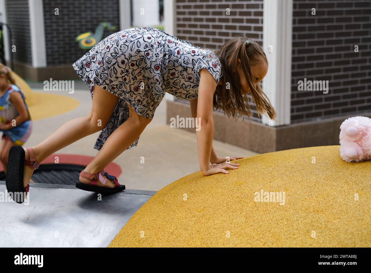 Child playing on playground in the city. Girl running. Preschooler ...