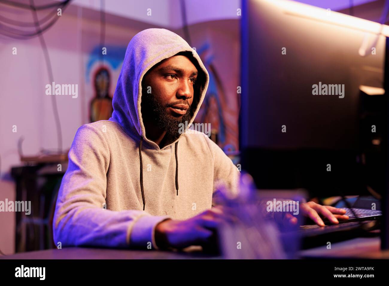 African american hacker cracking password to gain unauthorized access ...